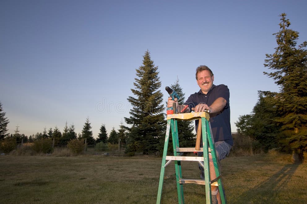 Man on Ladder - Horizontal stock image. Image of ladder - 5975333
