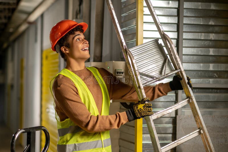 Smiling Warehouse Worker with the Ladder Stock Photo - Image of ...