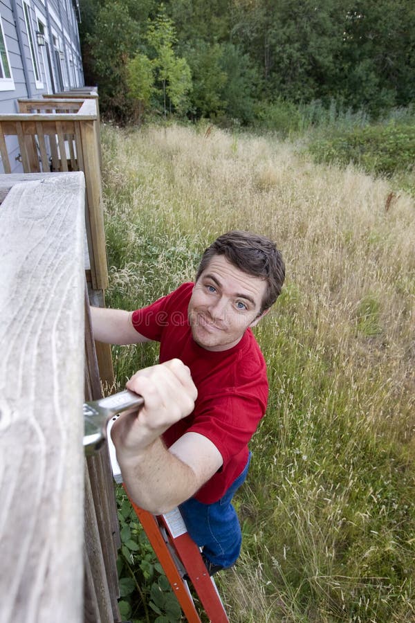 Man on Ladder - Vertical stock photo. Image of exterior - 6201864