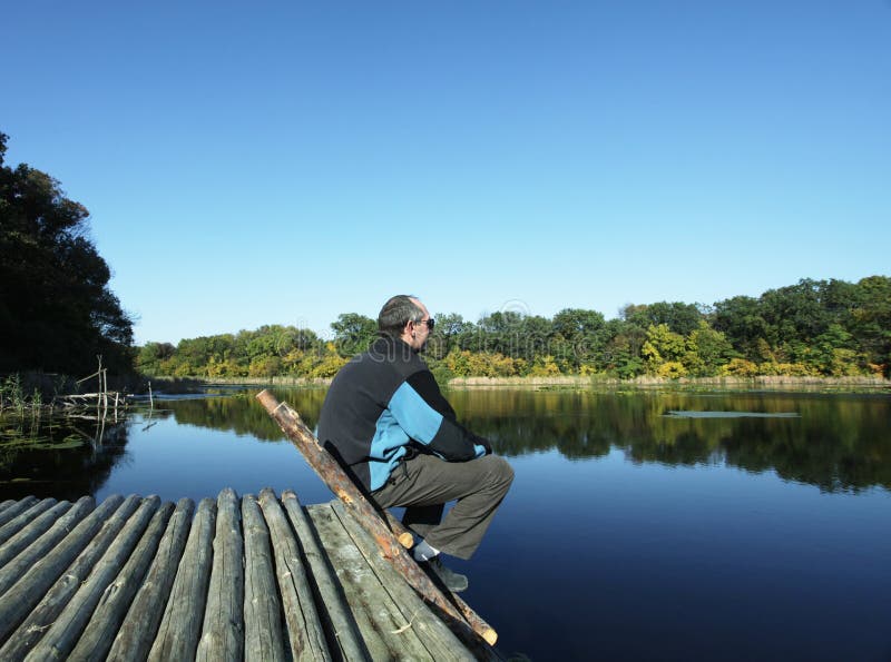 Man on the lake stock photo. Image of natural, active - 54178612