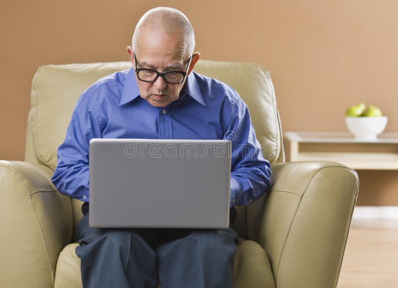 Man on Laptop stock image. Image of caucasian, home, seated - 10012139