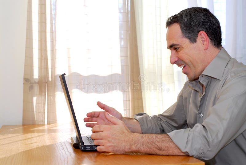 Man with laptop stock image. Image of joyous, home, male - 1599515