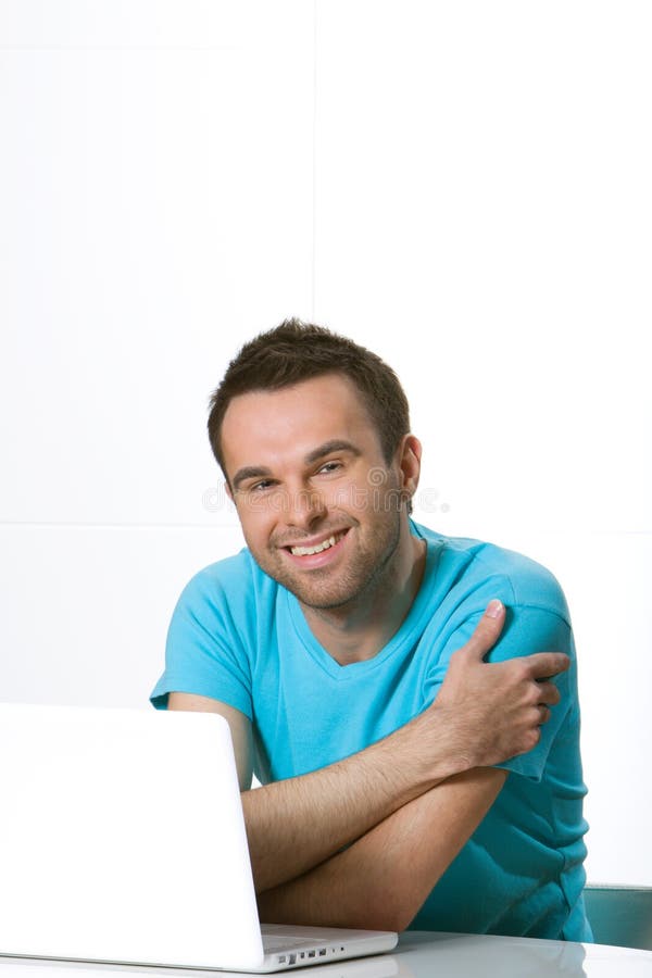 Man with laptop stock photo. Image of young, blue, indoors - 18714984