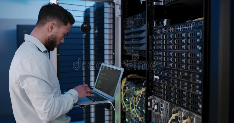 Man Laptop And Coding In Server Room With Programming Cybersecurity And System Update For