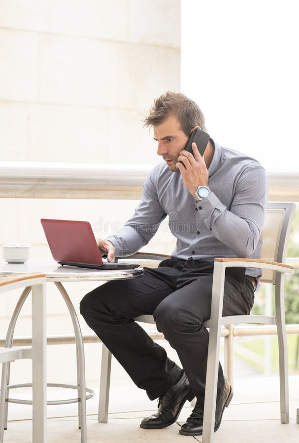Man Laptop Computer Talking Phone Terrace Bar Stock Photos - Free ...