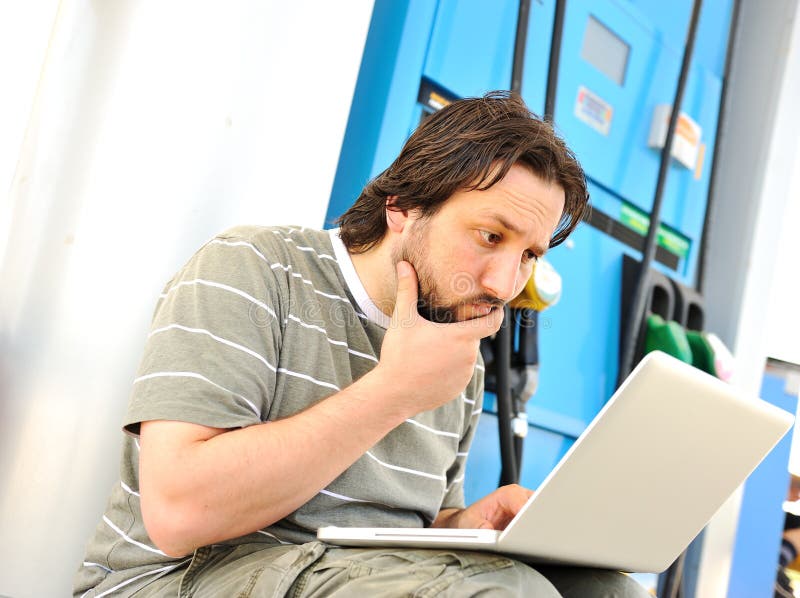 Man with Laptop on Gas Station Stock Image - Image of silly, energy ...