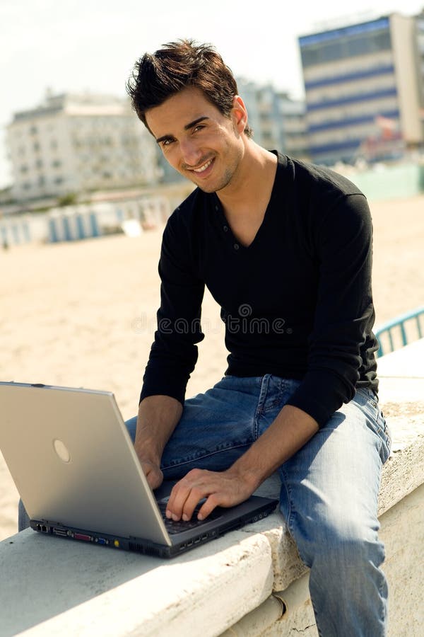 Young Man Working with Laptop Stock Image - Image of relax, attractive ...