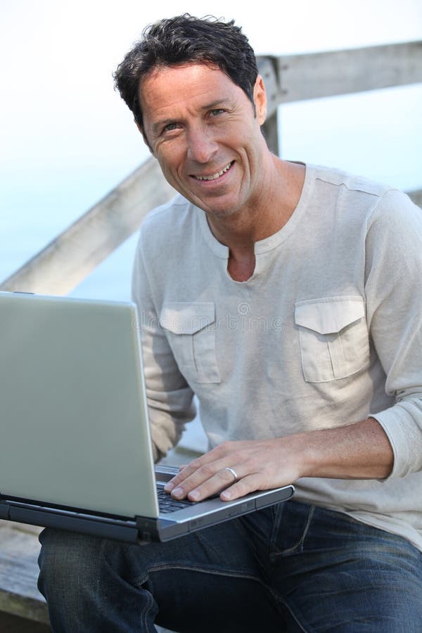 Man on laptop outside stock image. Image of sitting, frontview - 29296653