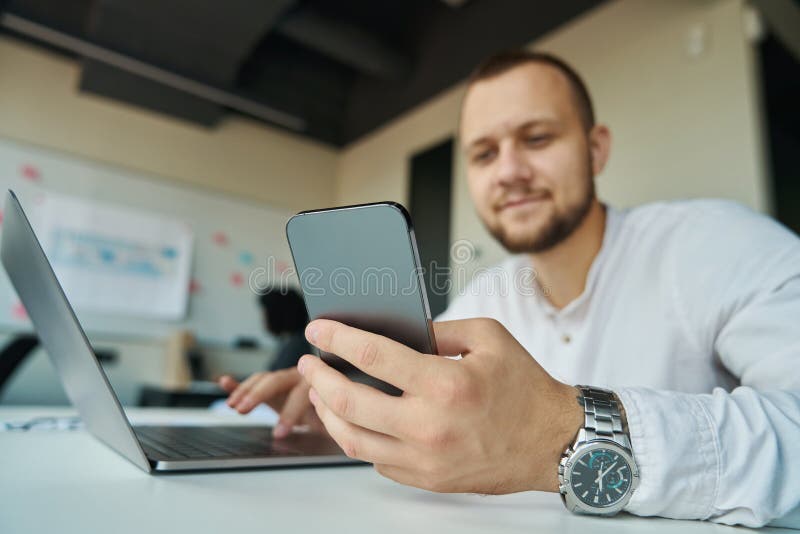 Man with Laptop and Phone Working in the Office Stock Image - Image of ...