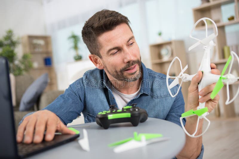 Man with Laptop Setting Up Drone Stock Photo - Image of innovation ...