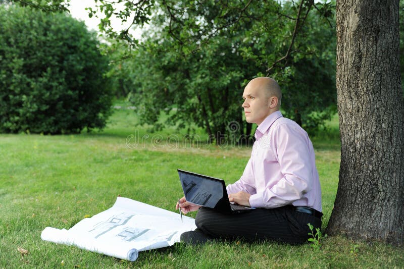 Man with Laptop Sitting Near a Tree Stock Photo - Image of resting ...