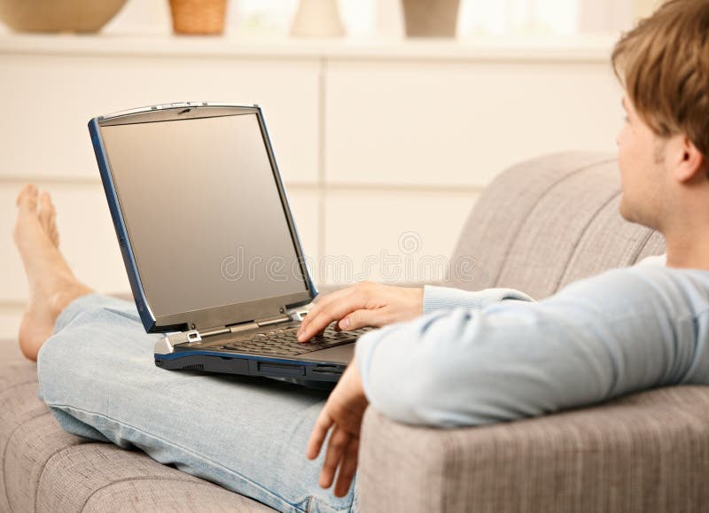 241 Man Sitting Sofa Laptop Barefoot Stock Photos - Free & Royalty-Free ...