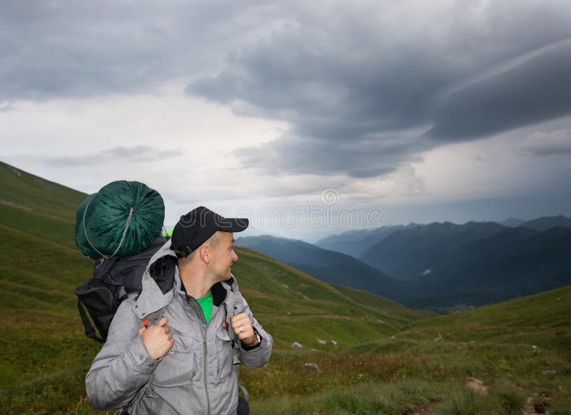 Man with a large backpack stock photo. Image of mountaineer - 77012674