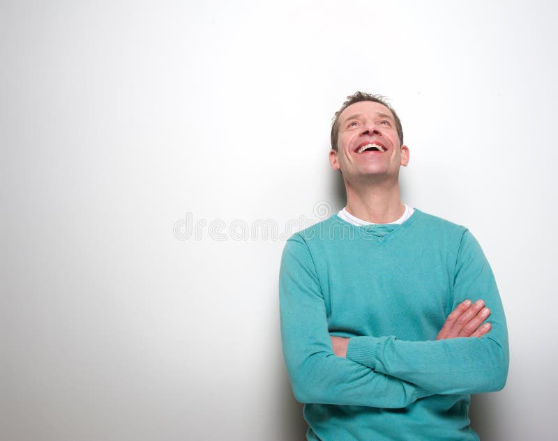 Man Laughing with Arms Crossed and Looking Up Stock Photo - Image of ...