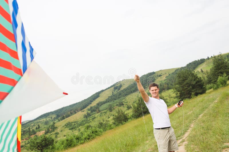 Man launching kite stock image. Image of colorful, communicate - 73563035