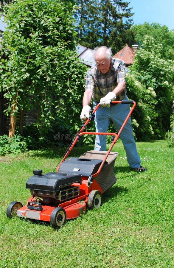 Man with lawn mower stock photo. Image of work, mower - 13453918