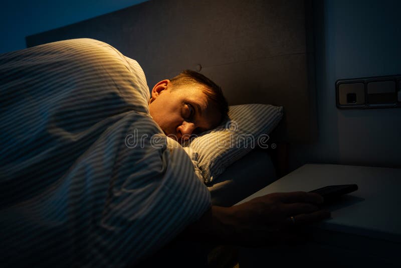 Man Lay Bed Looking Phone Screen Stock Photos - Free & Royalty-Free ...