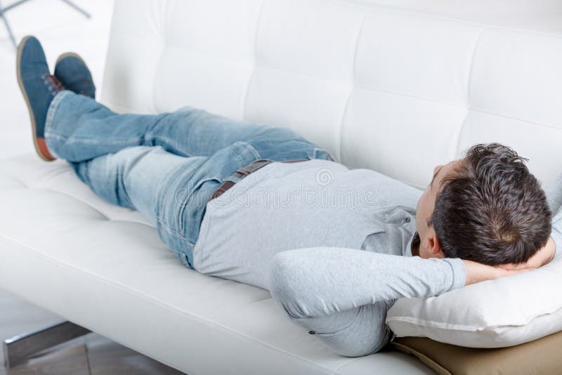 Man layed on sofa stock photo. Image of rest, asleep - 118900438