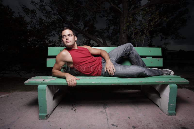 Man laying on a bench stock photo. Image of person, horizontal - 14326202
