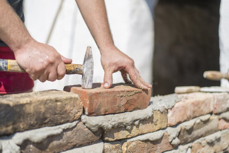 Man Laying Concrete Block And Bricks Wall Stock Image - Image of ...