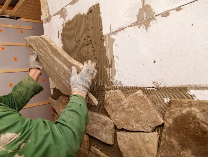 A Man is Laying Bricks on a Wall Stock Image - Image of putty, laying ...