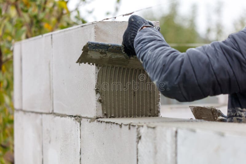 A Man is Laying Bricks on a Wall Stock Photo - Image of skill ...