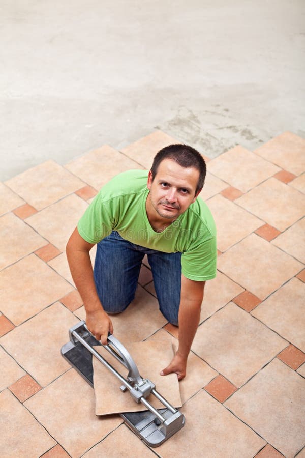 Man Laying Floor Tiles - with Copy Space Stock Image - Image of repair ...