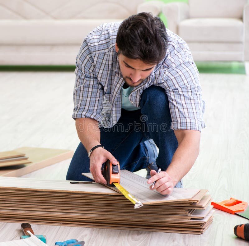 Man Laying Flooring at Home Stock Image - Image of carpentry, handyman ...