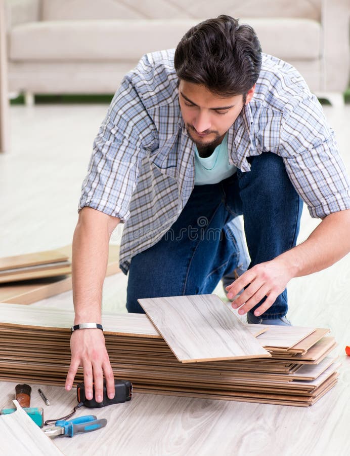 Man Laying Flooring at Home Stock Image - Image of husband, improvement ...