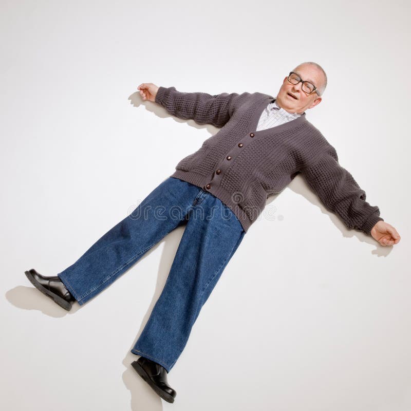 Man Laying on Ground with Arms Outstretched Stock Photo - Image of ...