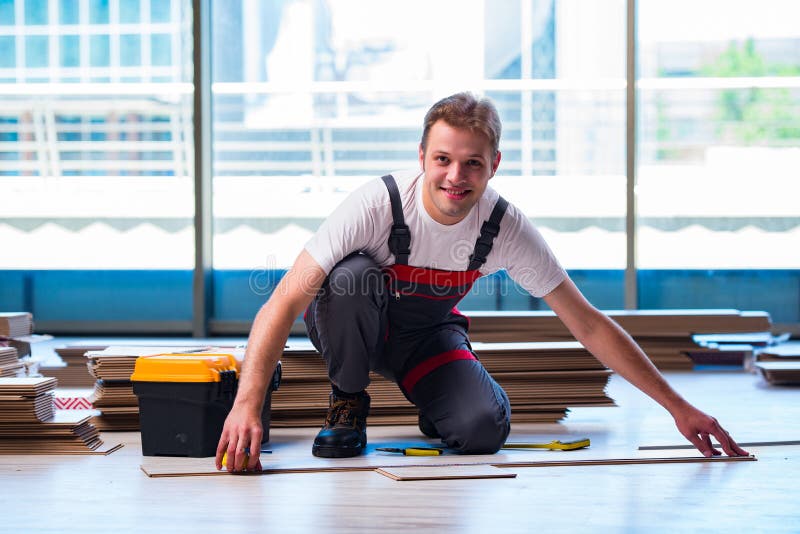 The Man Laying Laminate Flooring in Construction Concept Stock Image ...