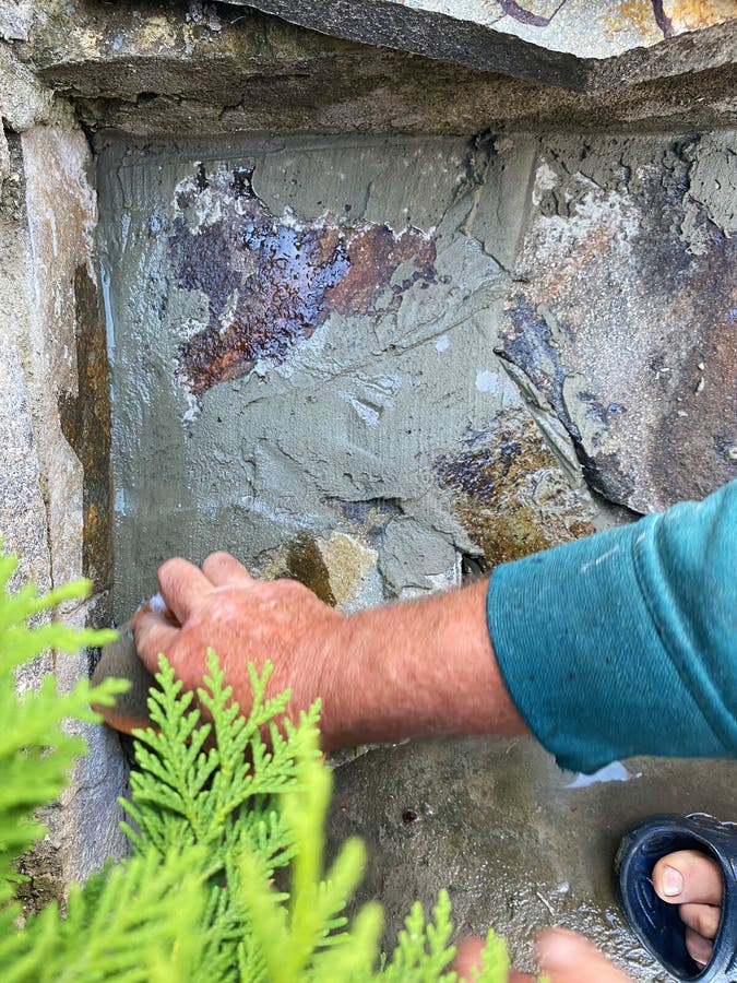 A Man Lays a Stone on the Paths on the Mortar Stock Photo - Image of ...