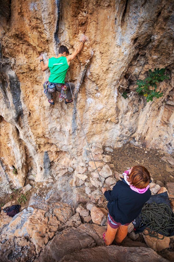 Man Lead Climbing Cliff Belayer Watching Him Stock Photos - Free ...