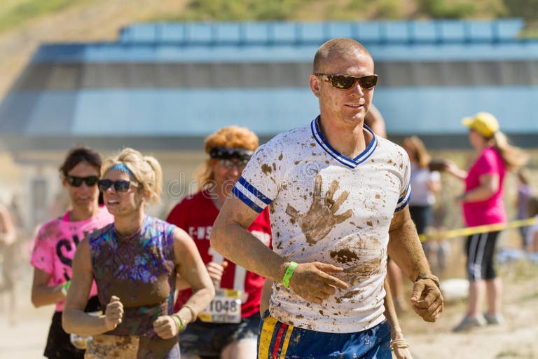 Man Leading the Pack at a Mud Race. Editorial Stock Image - Image of ...