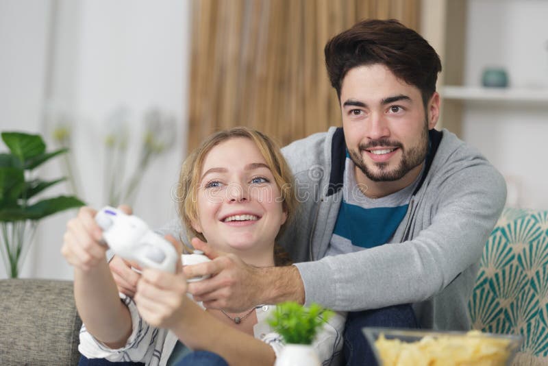 Man Leaning Across Girlfriend To Play Computer Game Stock Image - Image ...
