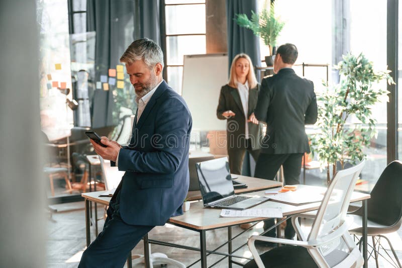 Man is Leaning on the Table. with Smartphone in Hands Stock Image ...