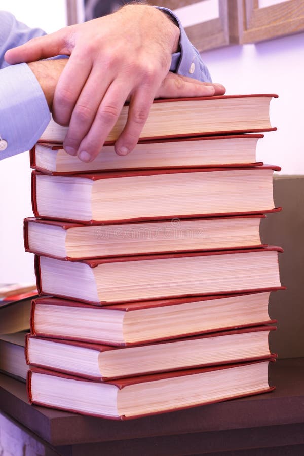 The Man Leans on a Stack of Books Stock Image - Image of multi ...