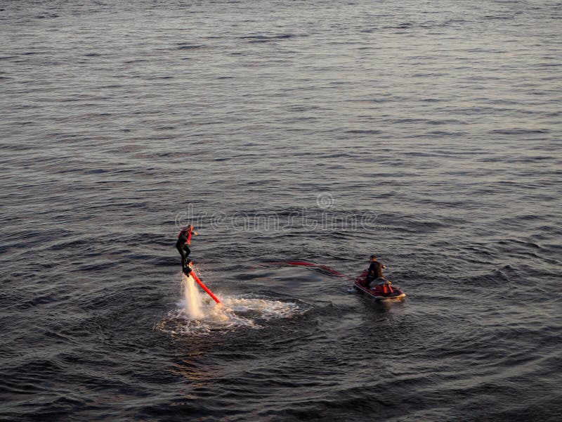 A Man is Learning Flysurfing Under the Supervision of an Instructor ...