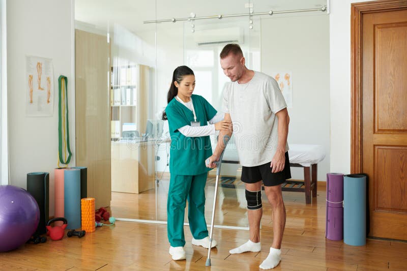 Man Learning How To Walk with Crutch Stock Image - Image of physical ...