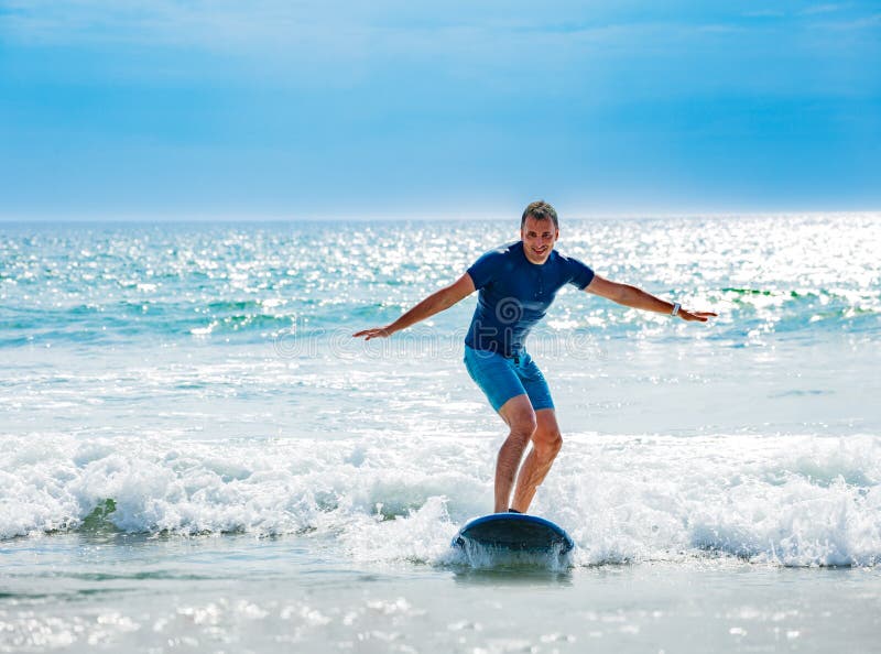 Man Learns To Surf Waves Balancing on Surfboard Stock Image - Image of ...
