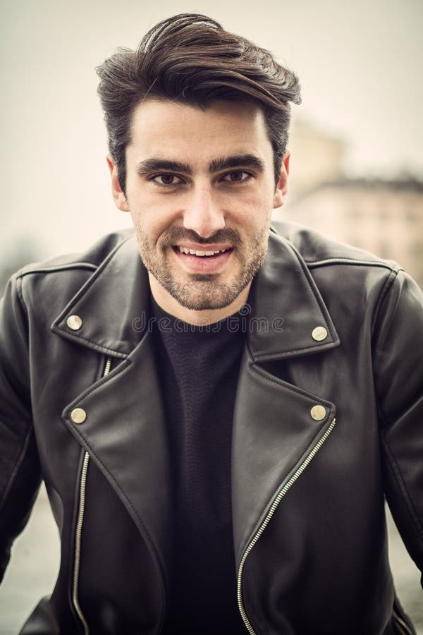 A Man in a Leather Jacket Smiling for the Camera Stock Photo - Image of ...