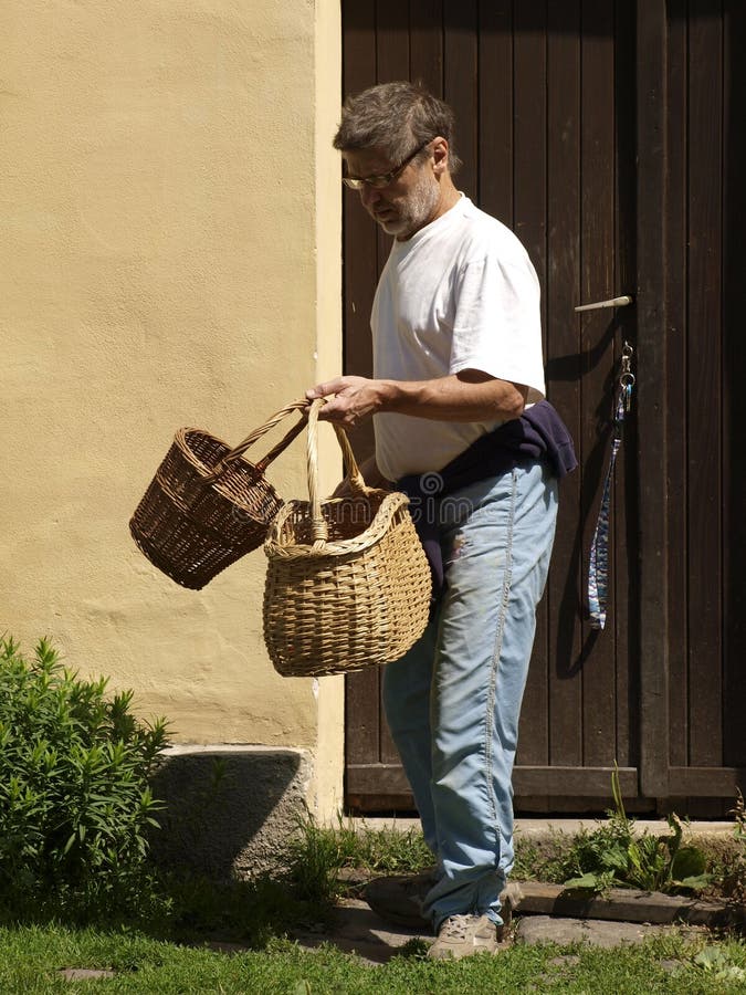 Man Leaving Home with Baskets Stock Image - Image of yellow, home: 15406683