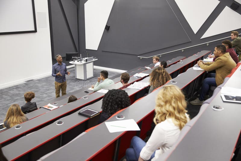 Man Lectures Students in Lecture Theatre, Mid Row Seat POV Stock Image ...