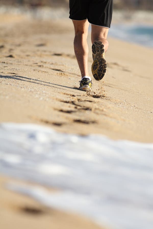 Man Legs Running on the Sand of a Beach Stock Photo - Image of sand ...
