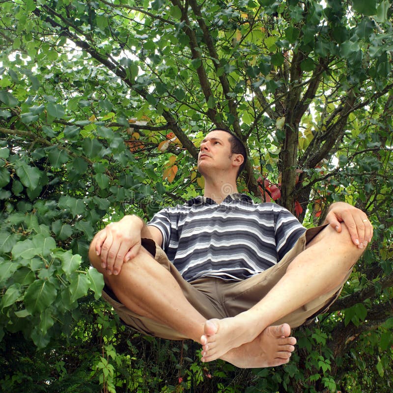 Man levitating in garden stock photo. Image of confidence - 28376120