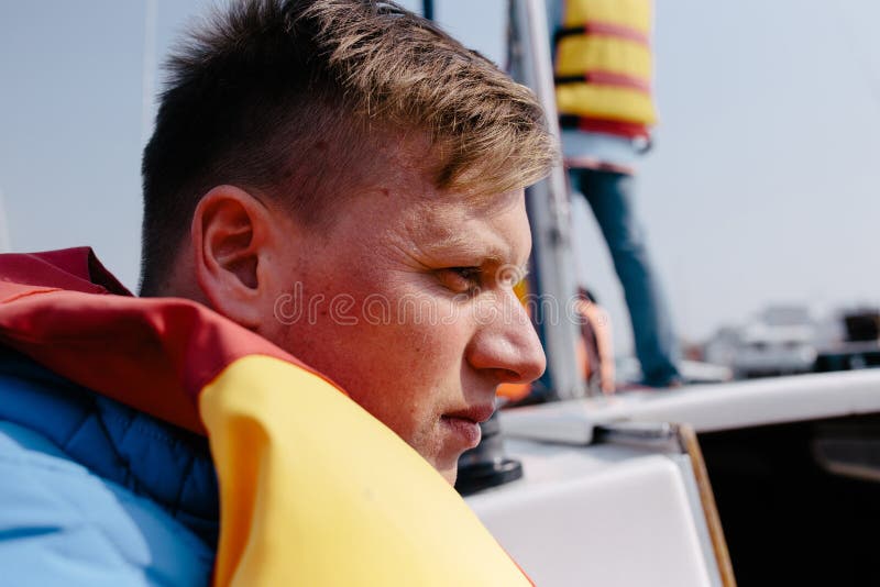 Man in life jacket on boat stock photo. Image of outdoor - 90620164