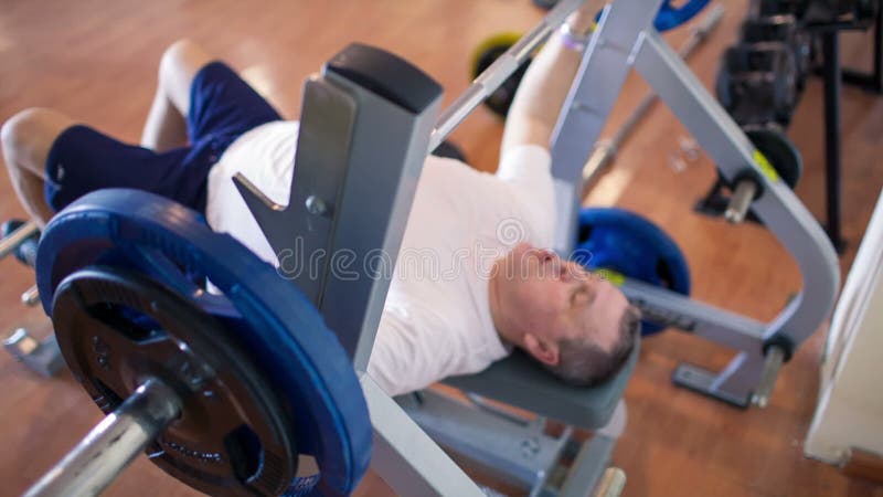 Man lifting the bar stock video. Video of lifting, training - 39547797