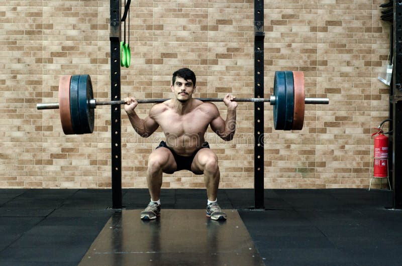 Man Lifting Barbell stock image. Image of exercise, trainer - 116504755