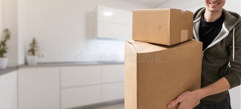 Man Lifting Cardboard Boxes in Apartment Interior. Stock Image - Image ...