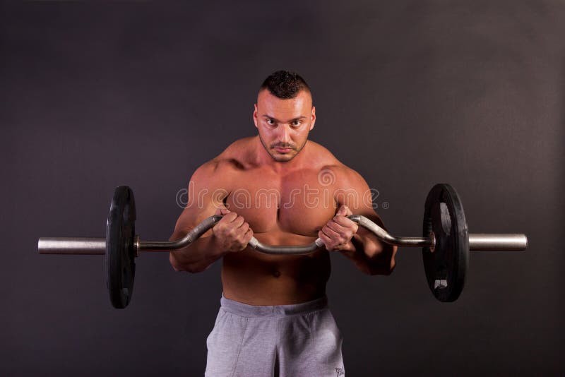 Man lifting weights stock photo. Image of strenght, dumbbells - 25276686